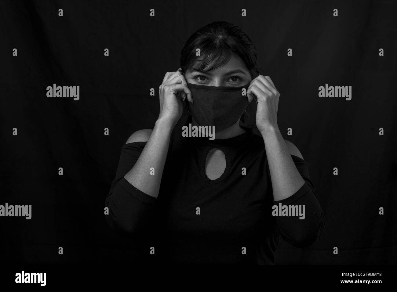 Ecuadorian woman with a bang wearing a fabric mask Stock Photo - Alamy