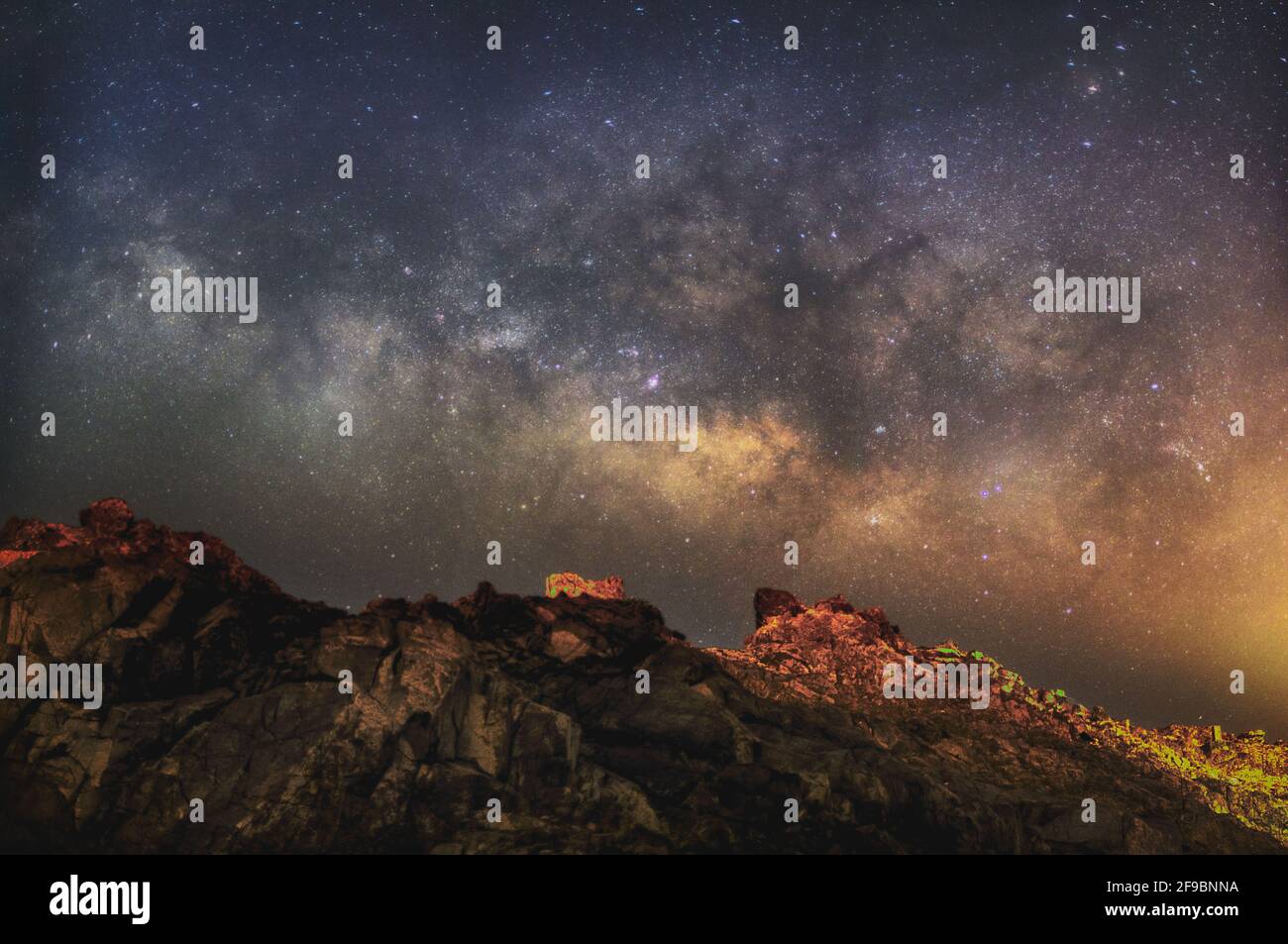 Mesmerizing view of the starry sky seen through mountains - perfect for ...