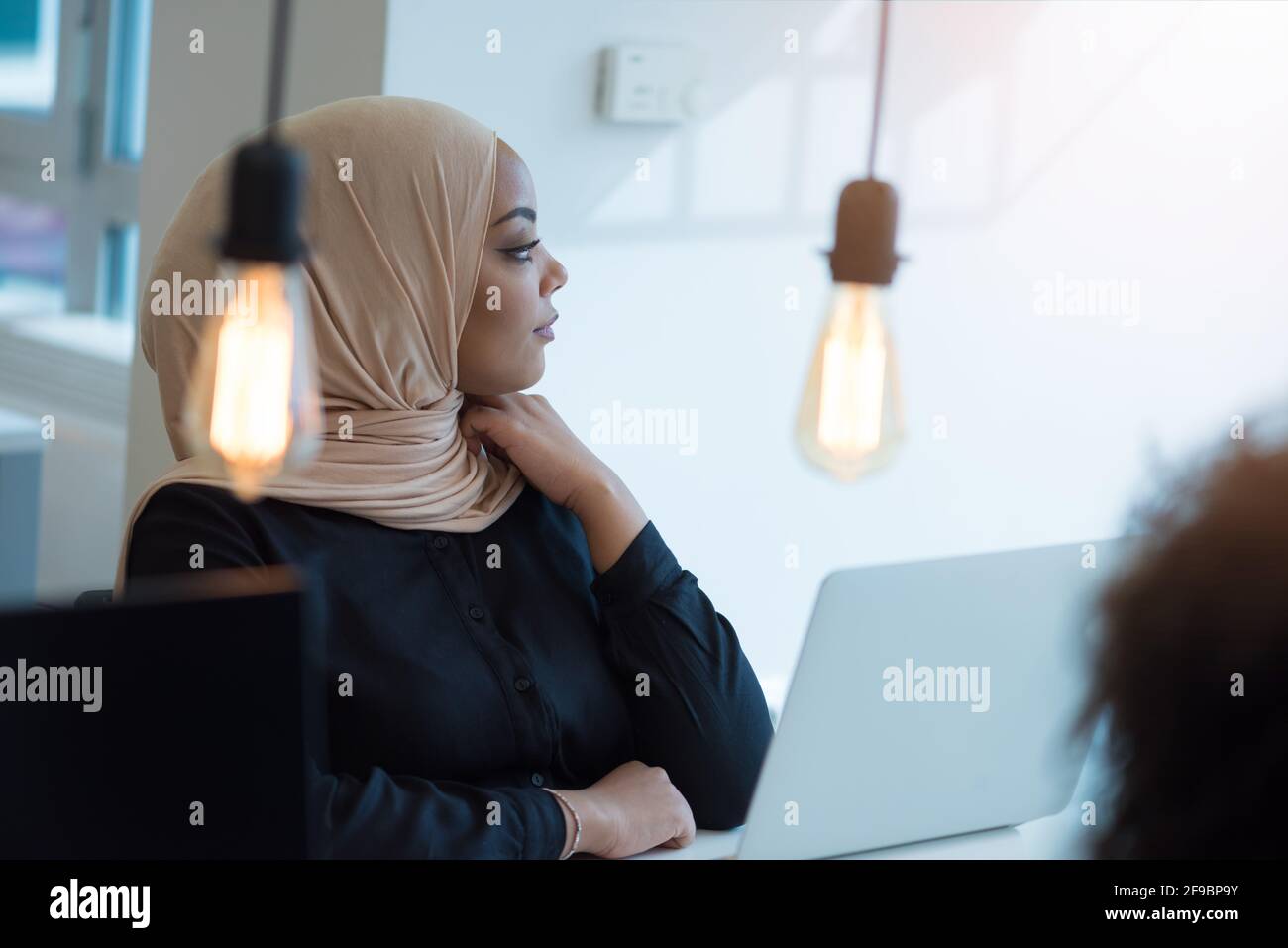 Young muslim African American business woman as a leader at work ...