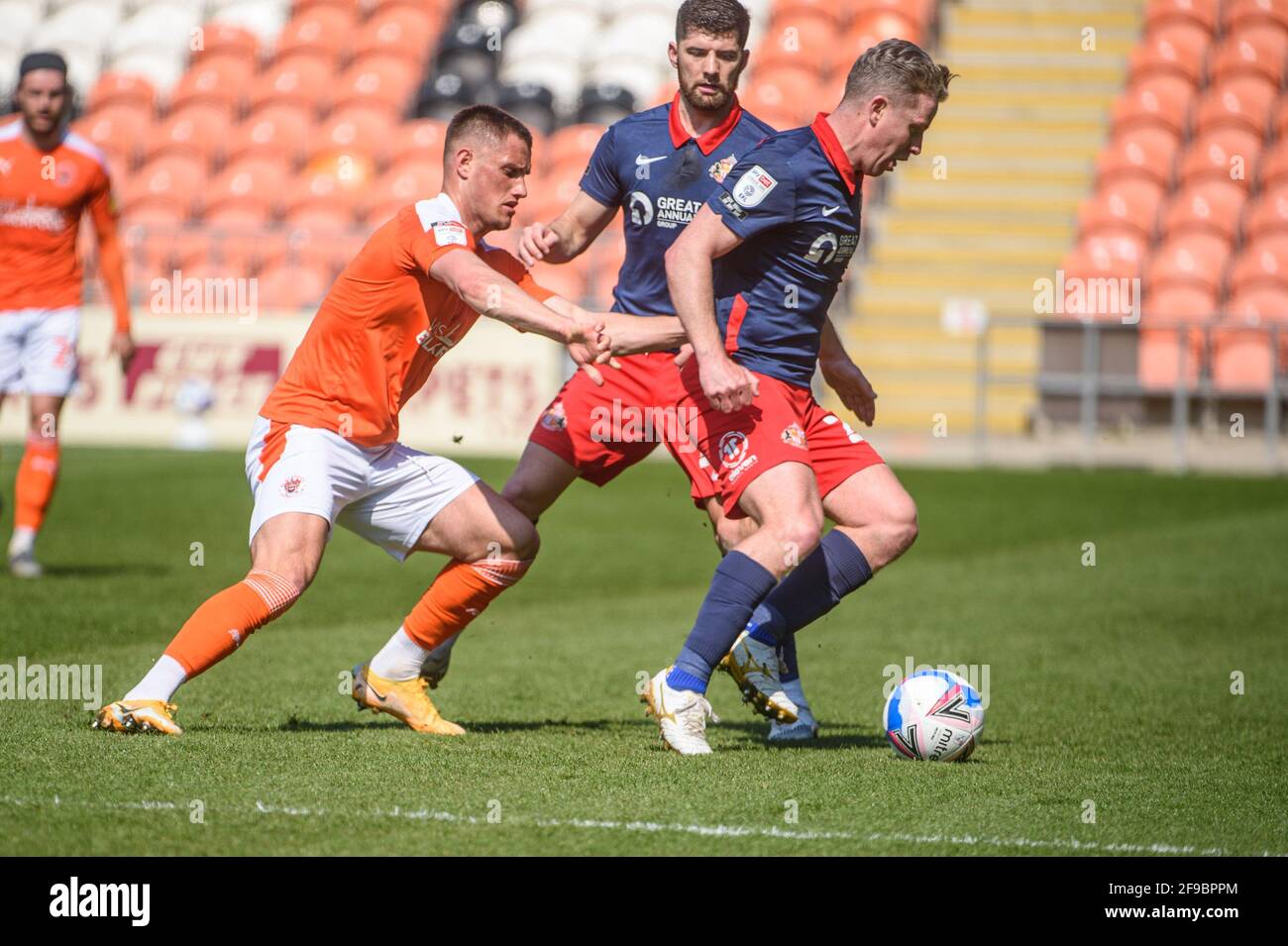 BLACKPOOL, UK. APRI 17TH Jerry Yates of Blackpool FC tries to tackle ...
