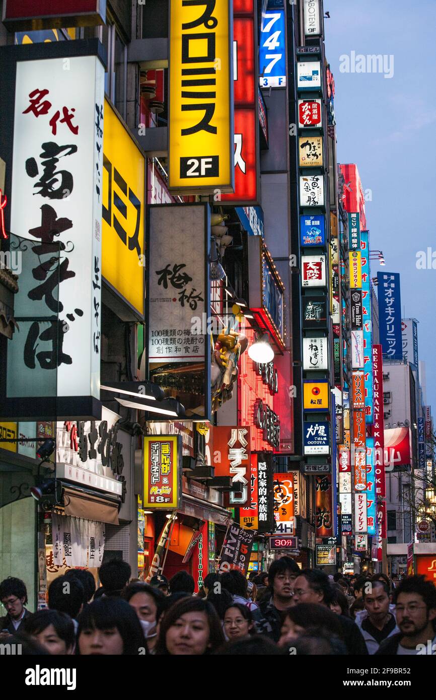 Colourful neon signs on buildings in Shinjuku early evening, Tokyo ...