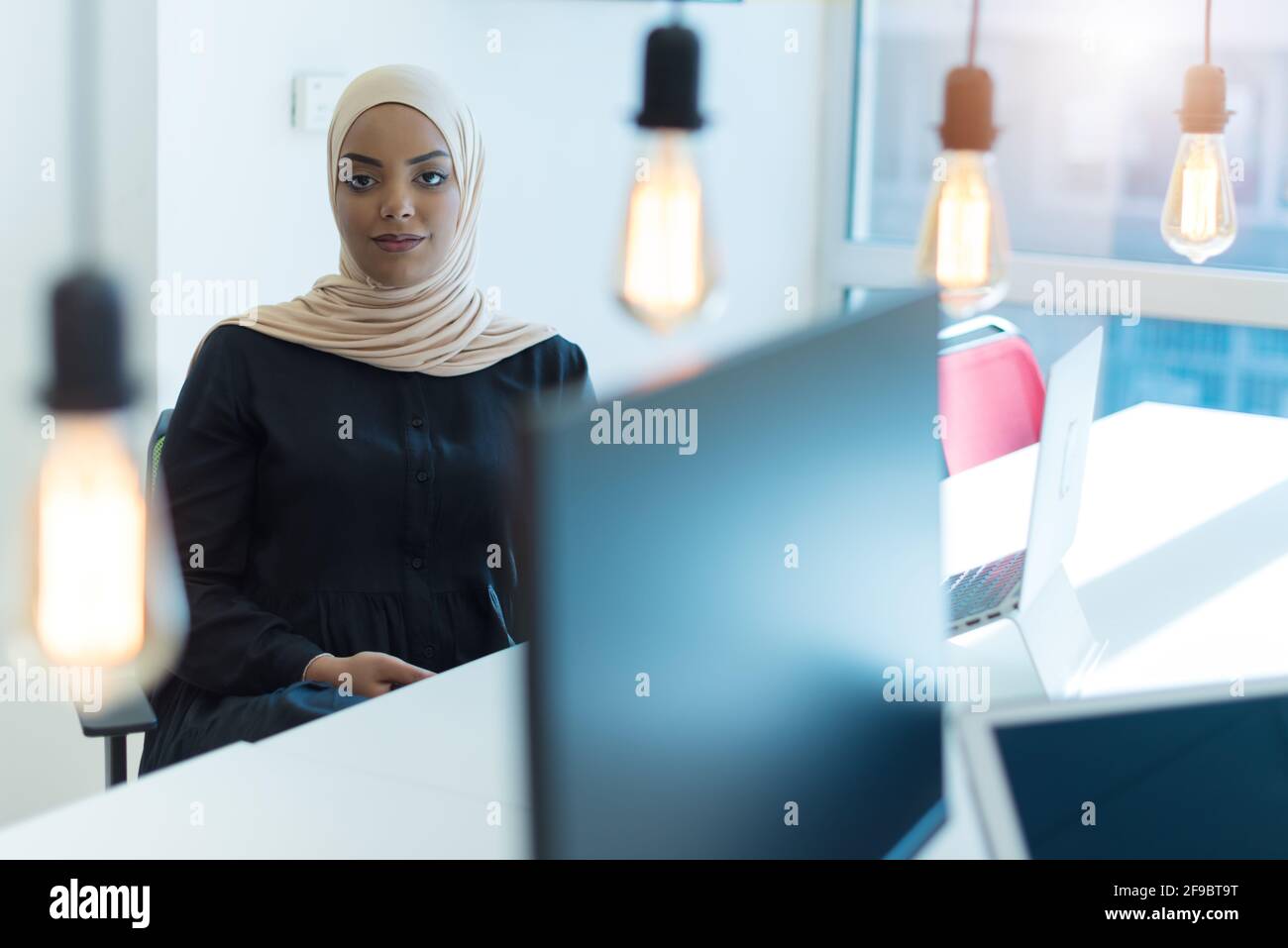 Young muslim African American business woman as a leader at work ...