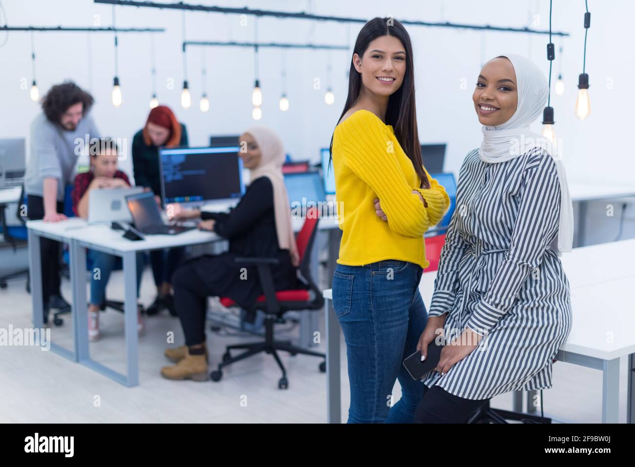 Creative multiethnic business people group as freelancers in modern ...