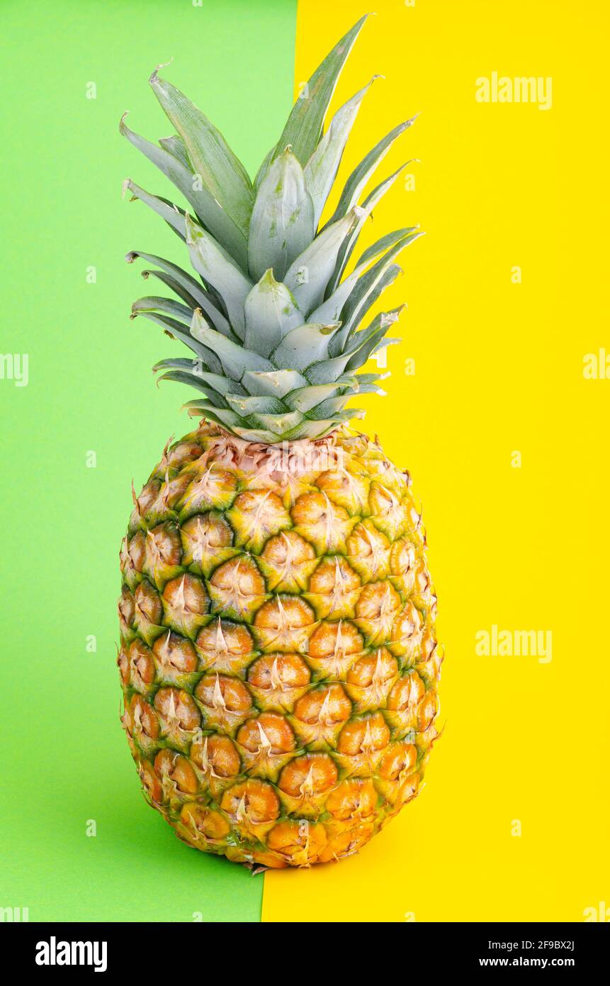 Whole pineapple fruit on bright background. Studio Photo Stock Photo ...