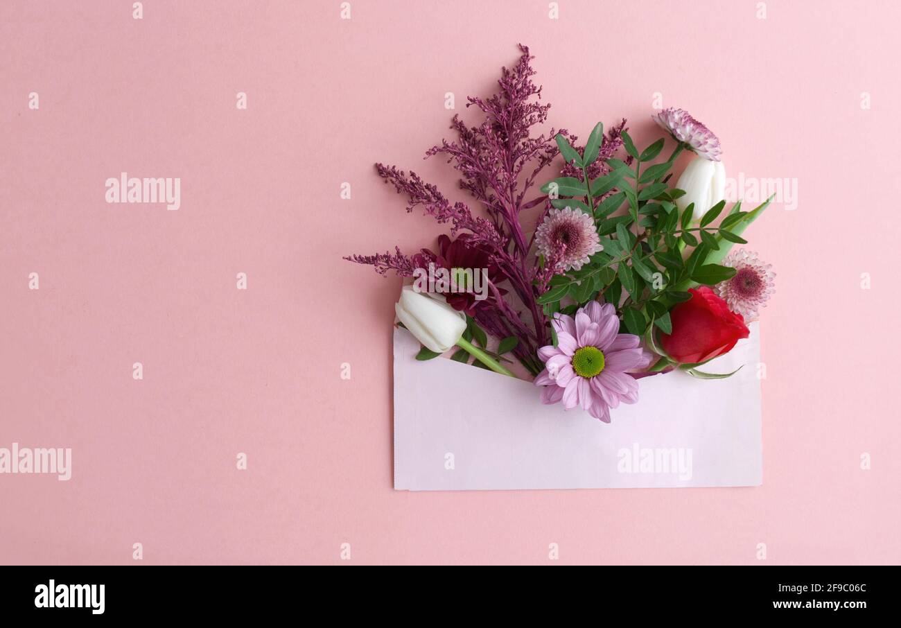 Assorted flowers inside an envelope closeup Stock Photo - Alamy