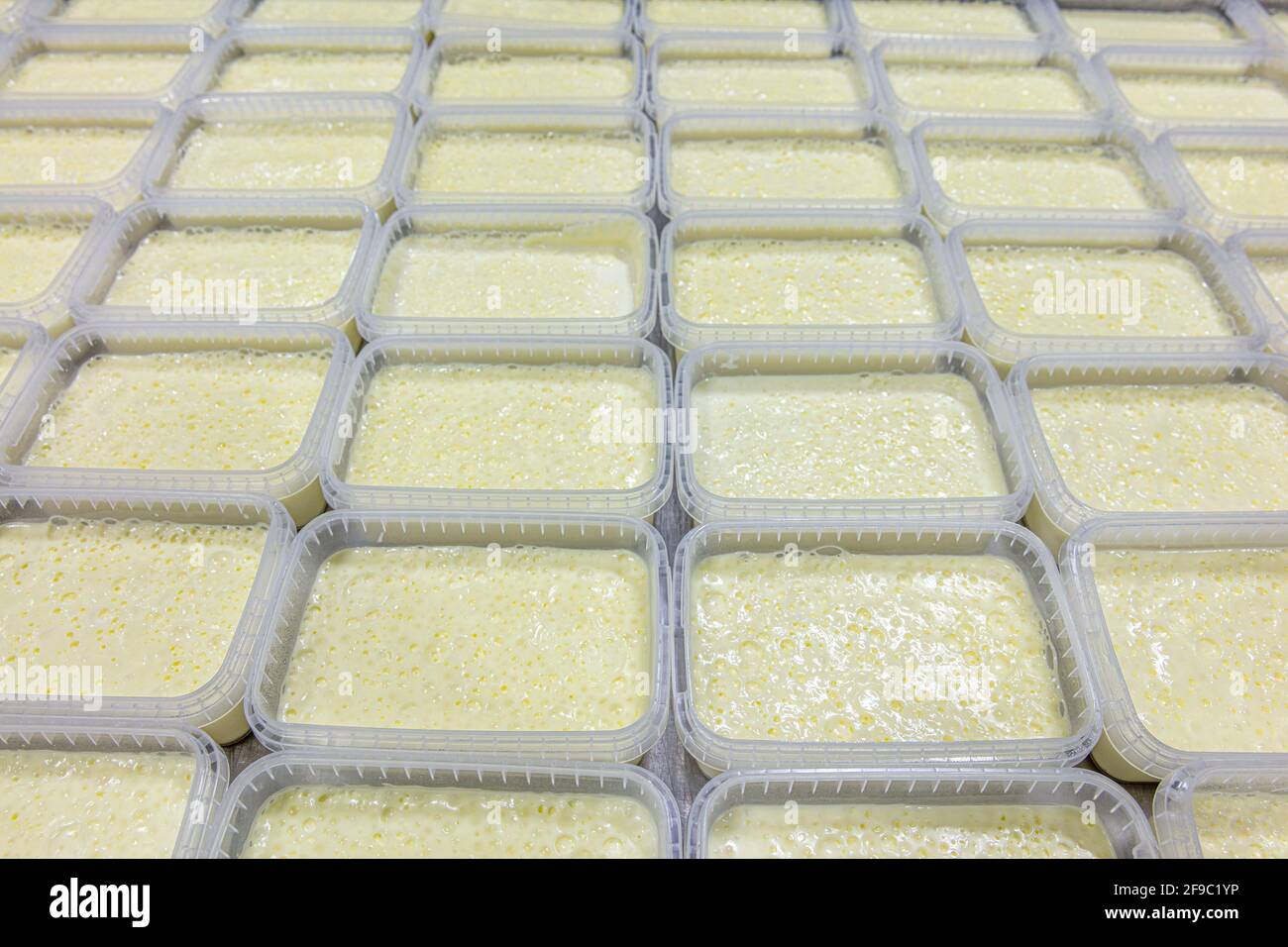 Milky cream wavy surface. Close-up. Milk cream layer texture. Clotted ...