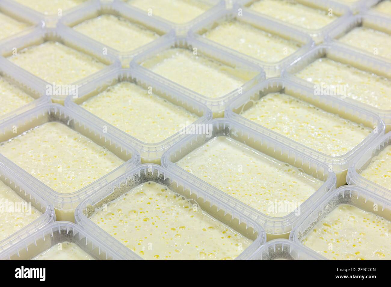 Milky cream wavy surface. Close-up. Milk cream layer texture. Clotted ...