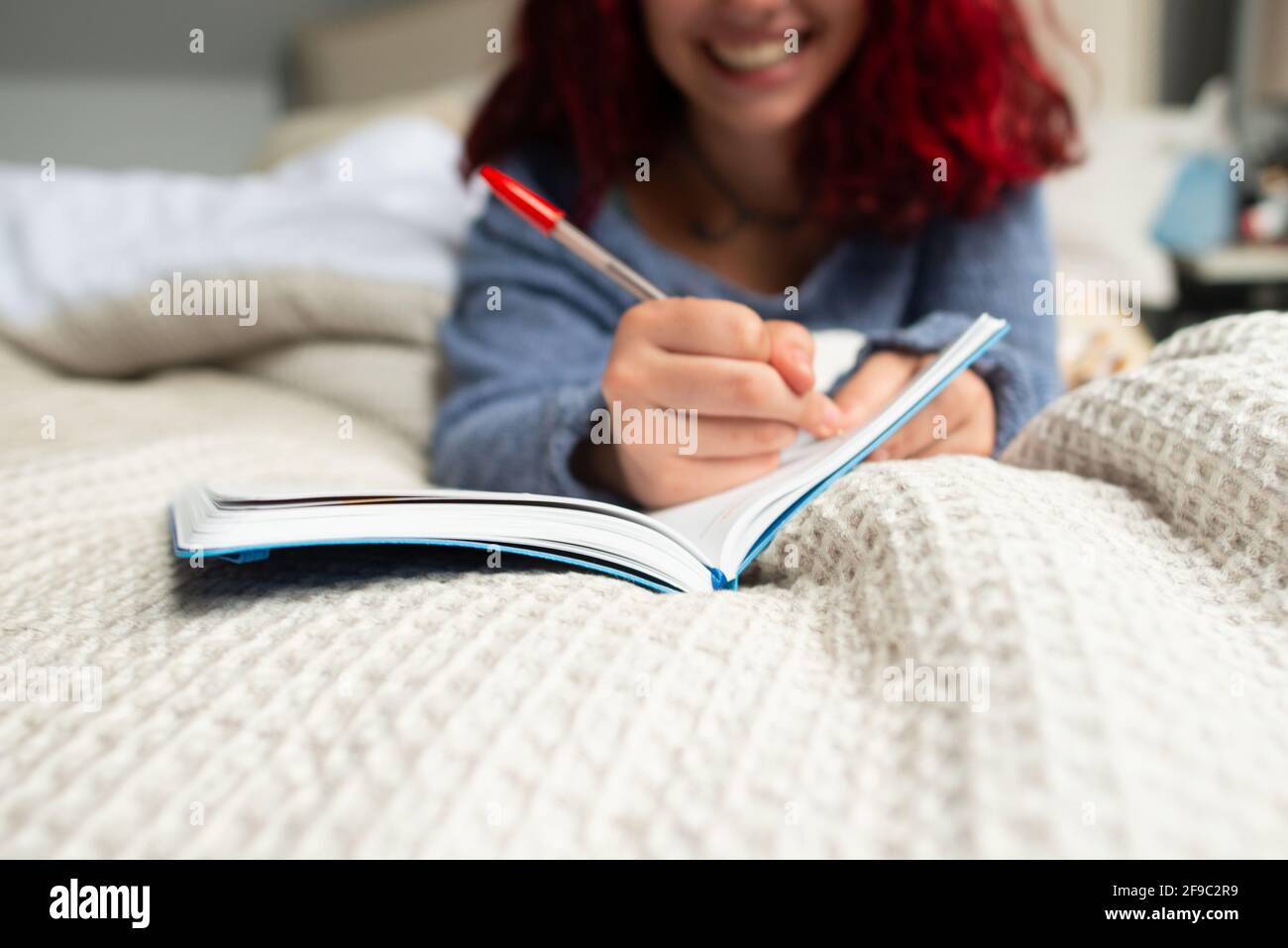 Gen Z writing in her journal Stock Photo - Alamy