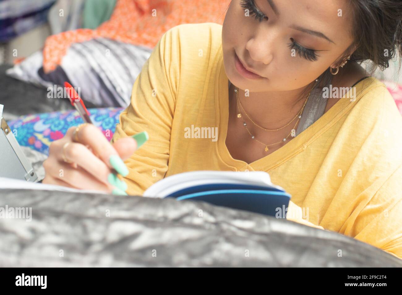 Gen Z writing in her journal Stock Photo - Alamy