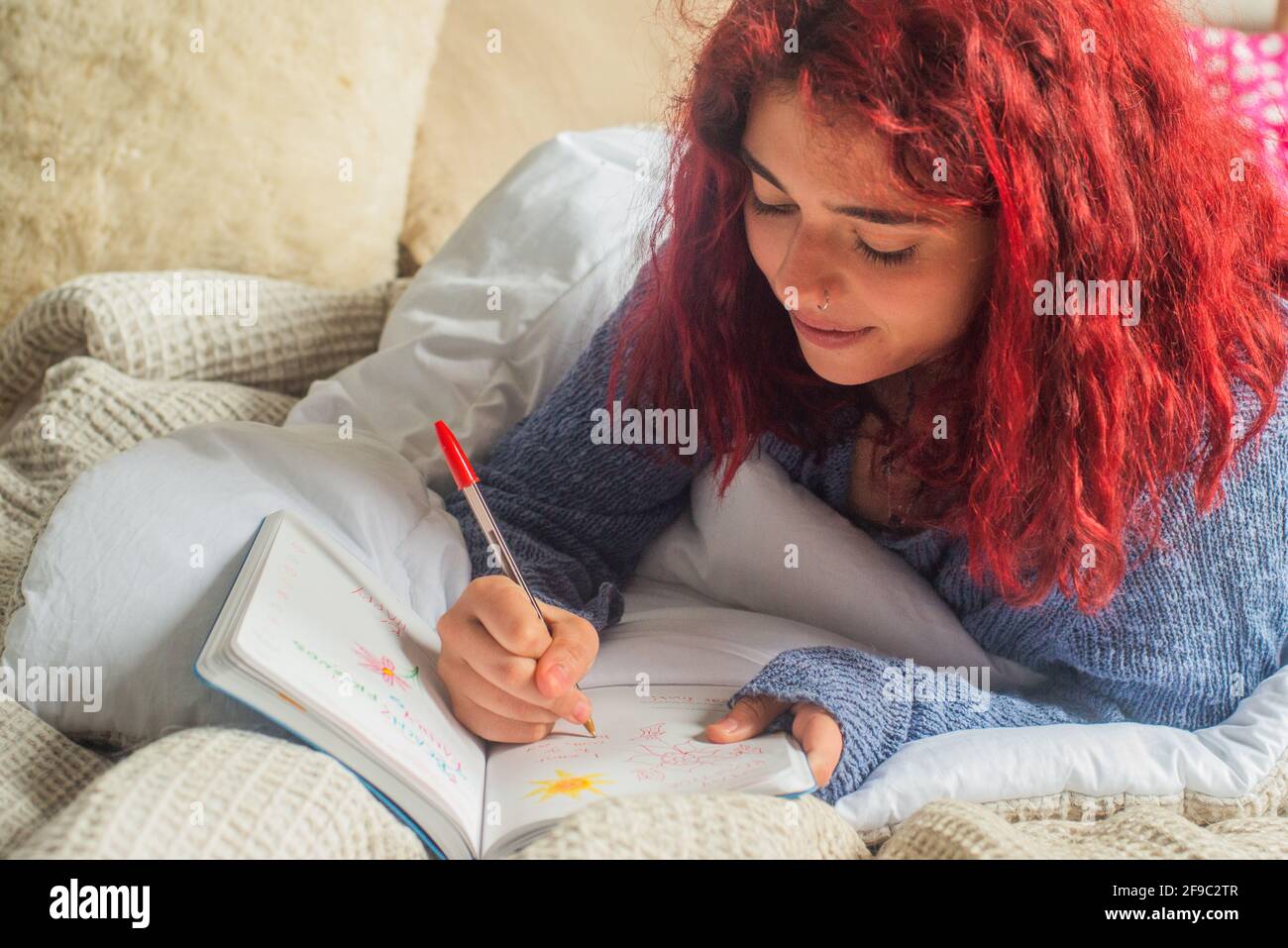 Gen Z writing in her journal Stock Photo - Alamy