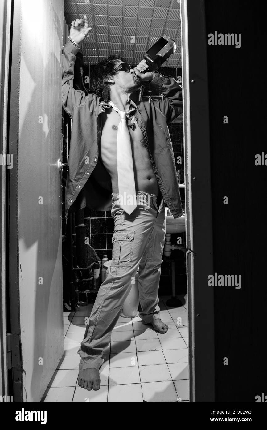 Drunk man standing in toilet hi-res stock photography and images - Alamy