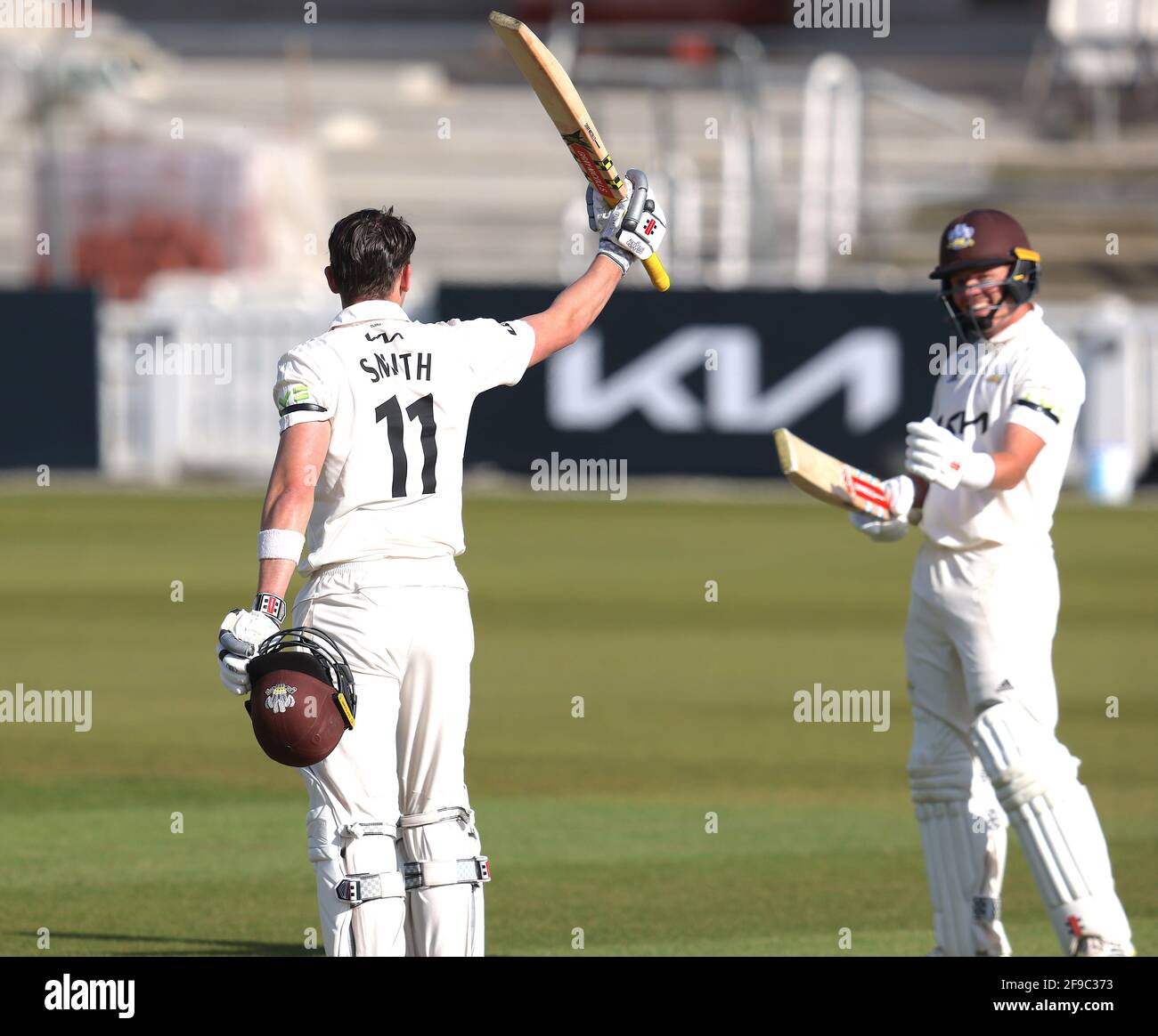 17 April, 2021. London, UK. Surrey’s Jamie Smith raises his bat after ...