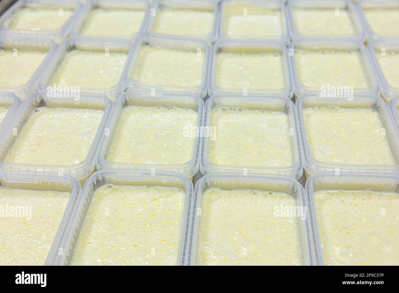 Milky cream wavy surface. Close-up. Milk cream layer texture. Clotted ...