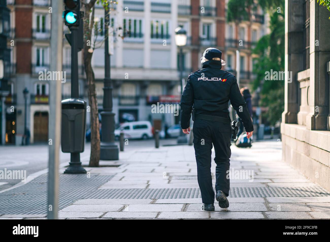 Policewoman member of the Spanish security forces and bodies walking ...