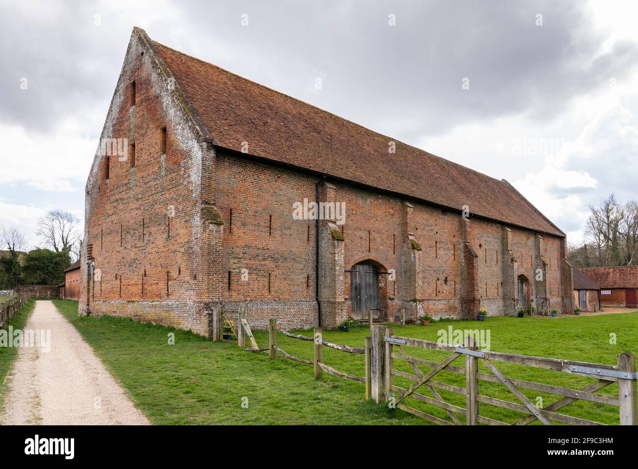 The historic 16th century brick Tudor Great Barn near Basing House in ...