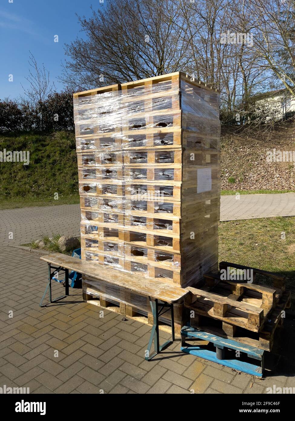 many new wooden pallets are stacked on top of each other and wrapped in ...