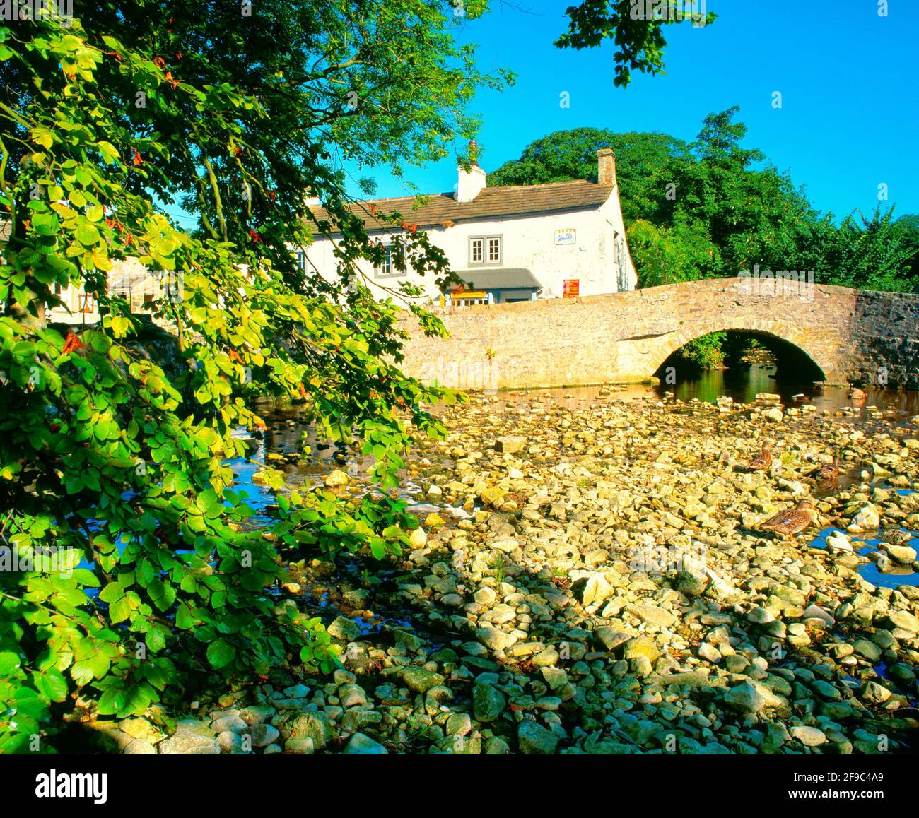 UK, England, North Yorkshire, Dales, Malham village, bridge over river ...