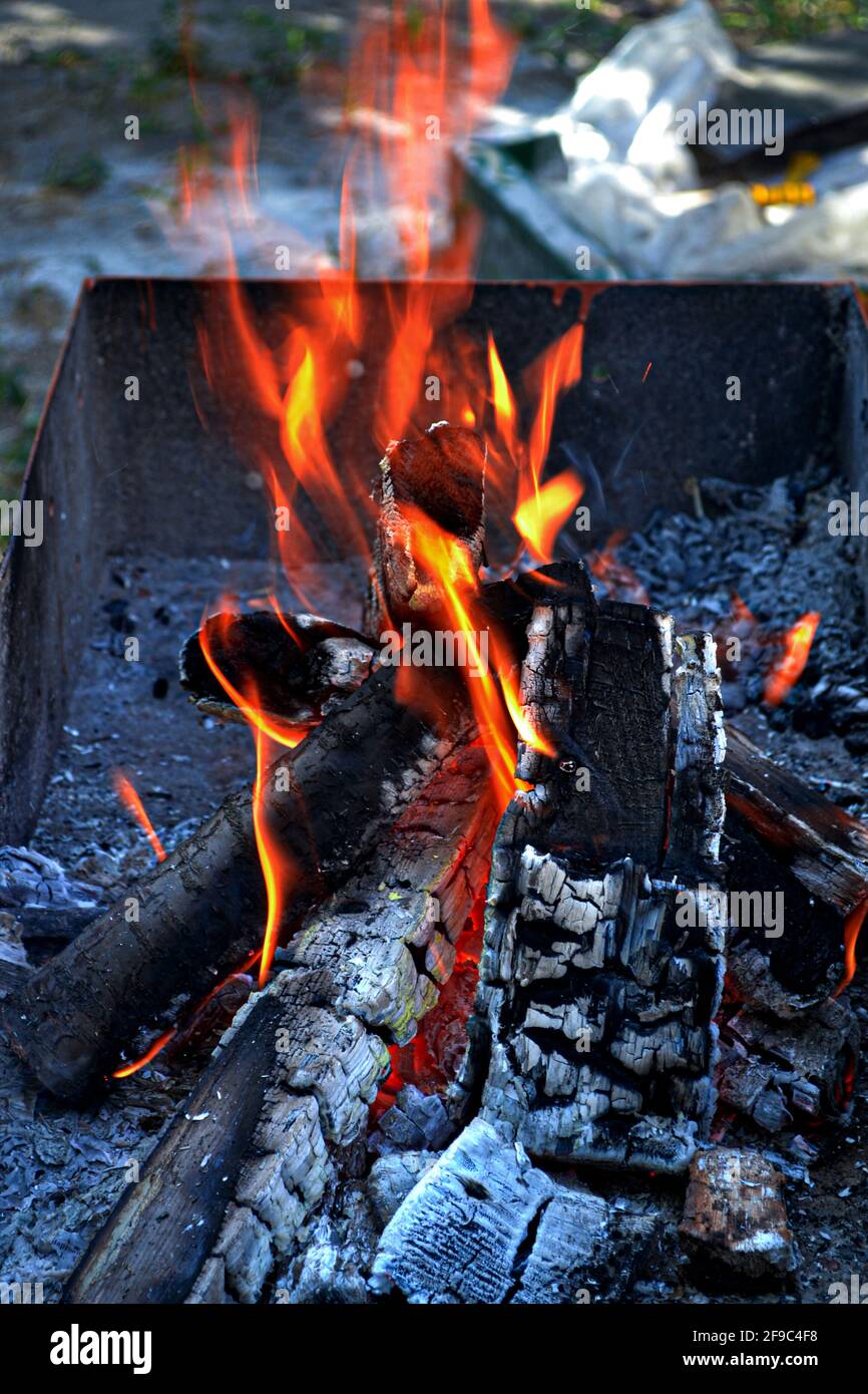 firewood burns in the grill Stock Photo - Alamy