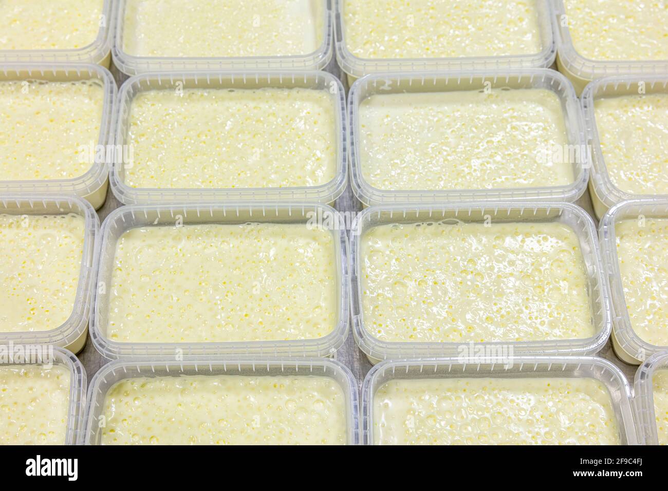 Milky cream wavy surface. Close-up. Milk cream layer texture. Clotted ...