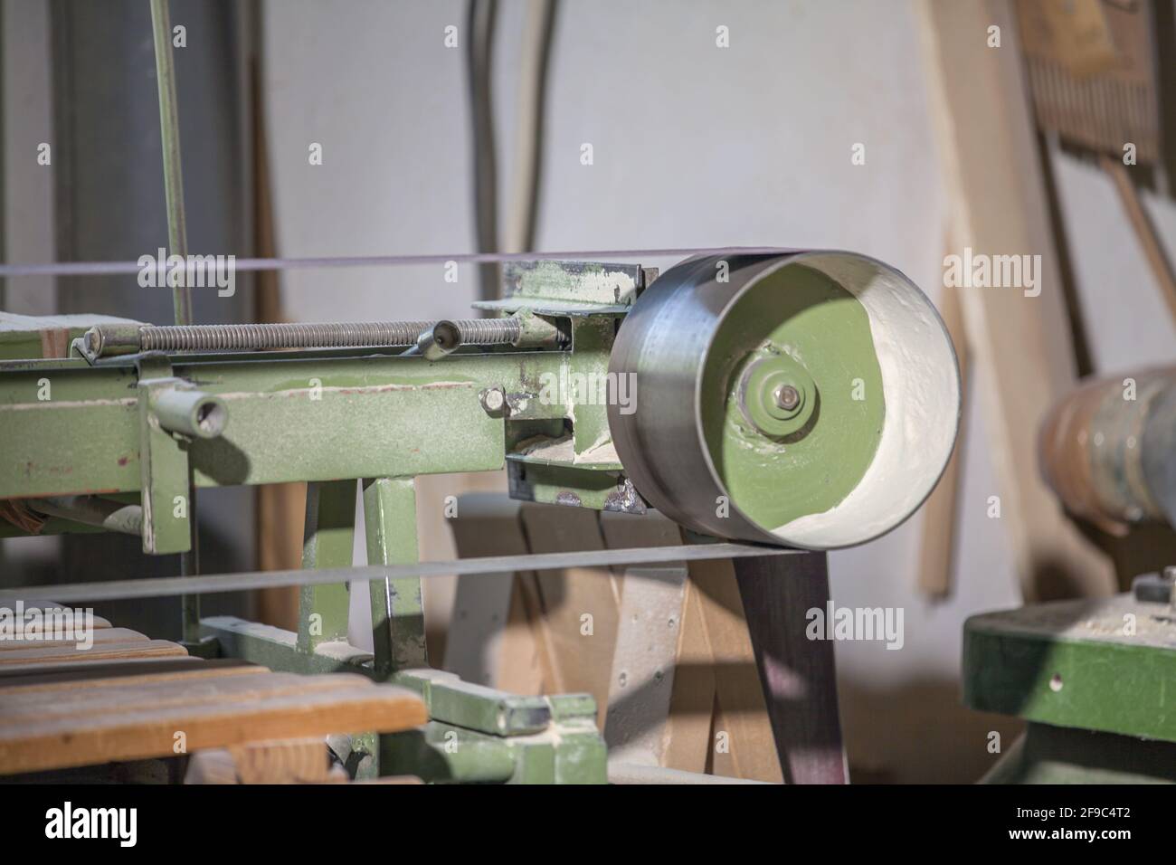 Machine with a belt for shaping wood into beautiful and unique designs ...