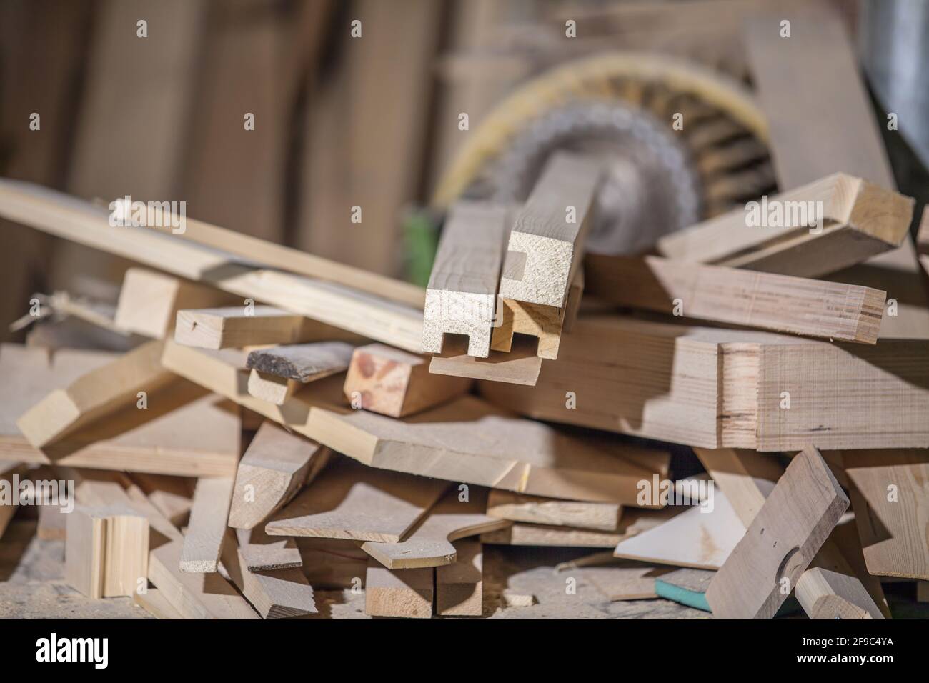 Different sizes and shapes of wooden boards lying on the floor in a ...
