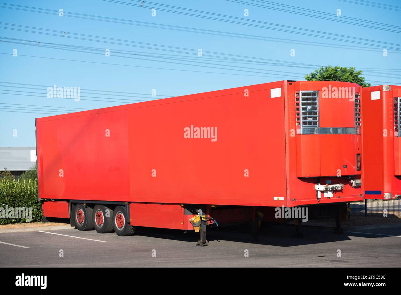 Modern trailer of a forwarding company, parked outdoors during daylight ...