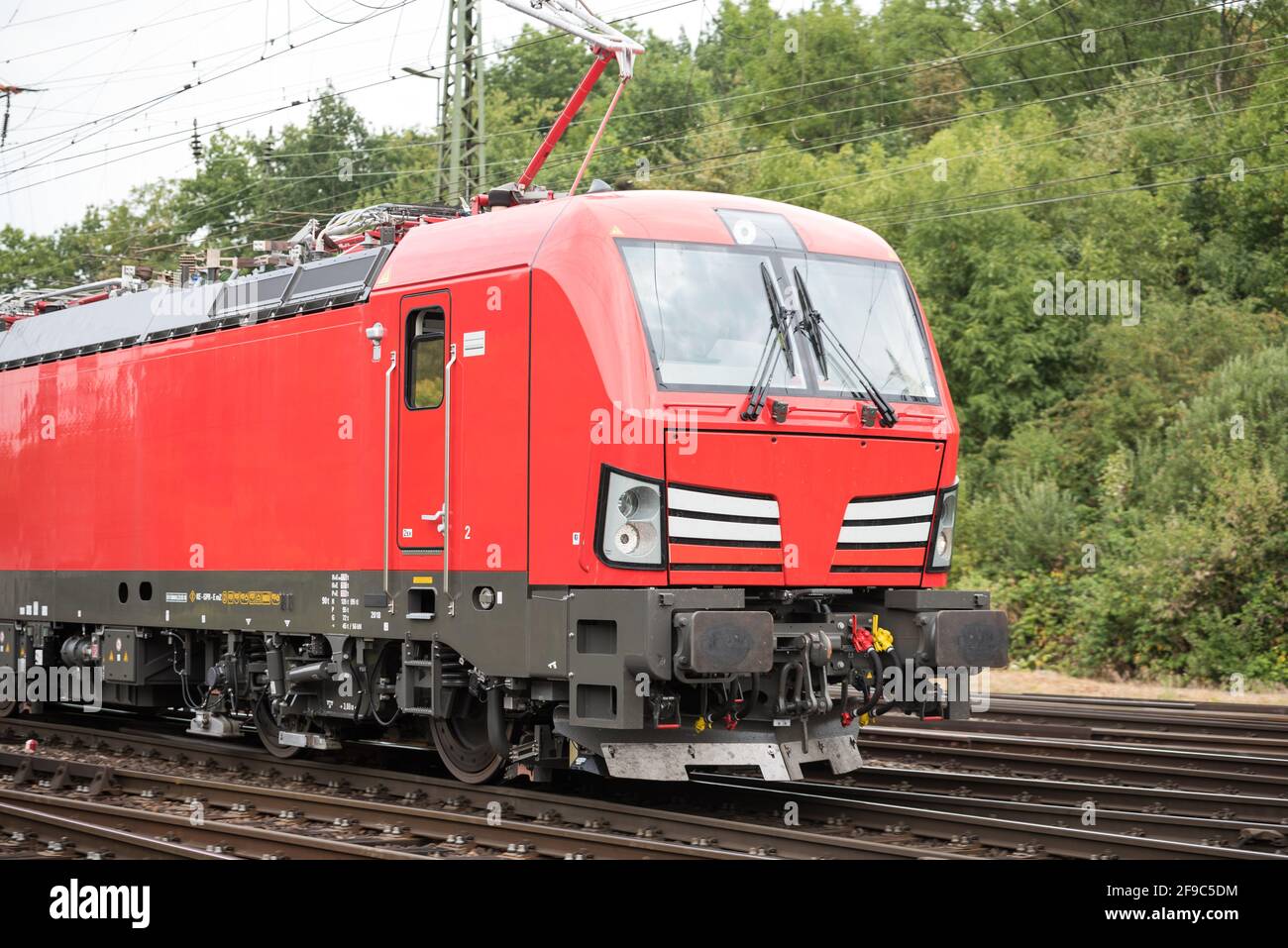 Modern electric locomotive on the line during daylight Stock Photo - Alamy