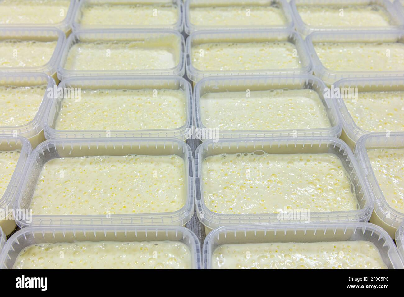 Milky cream wavy surface. Close-up. Milk cream layer texture. Clotted ...