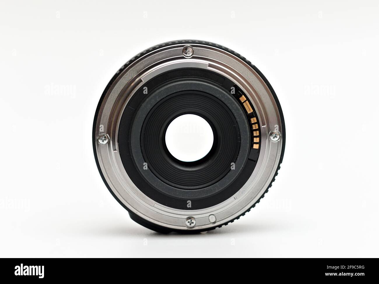 Shiny 24mm unnamed lens mount for a DSLR camera lying on its side ...