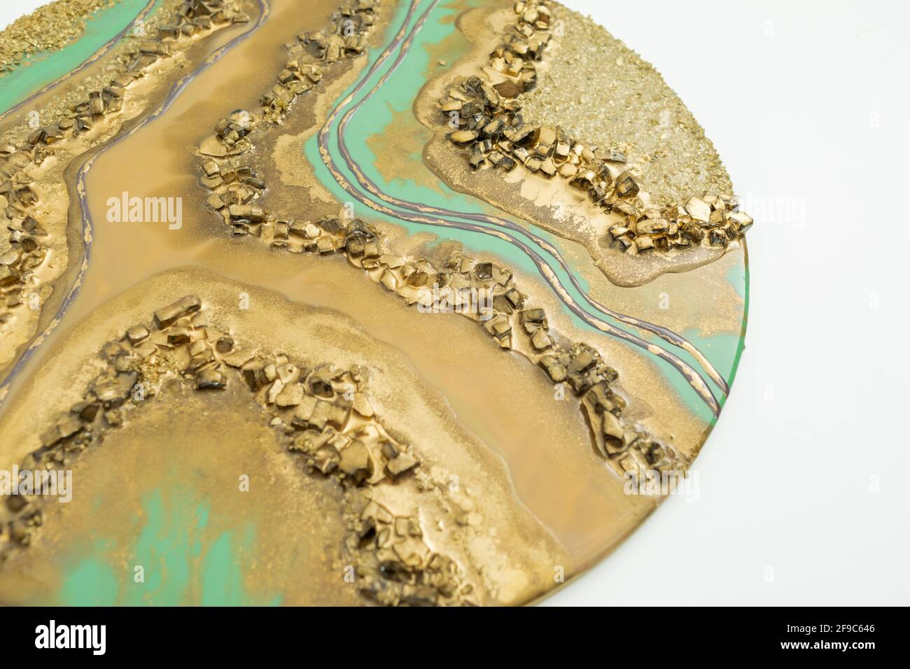 Resin art painting with golden colors and glass Stock Photo - Alamy