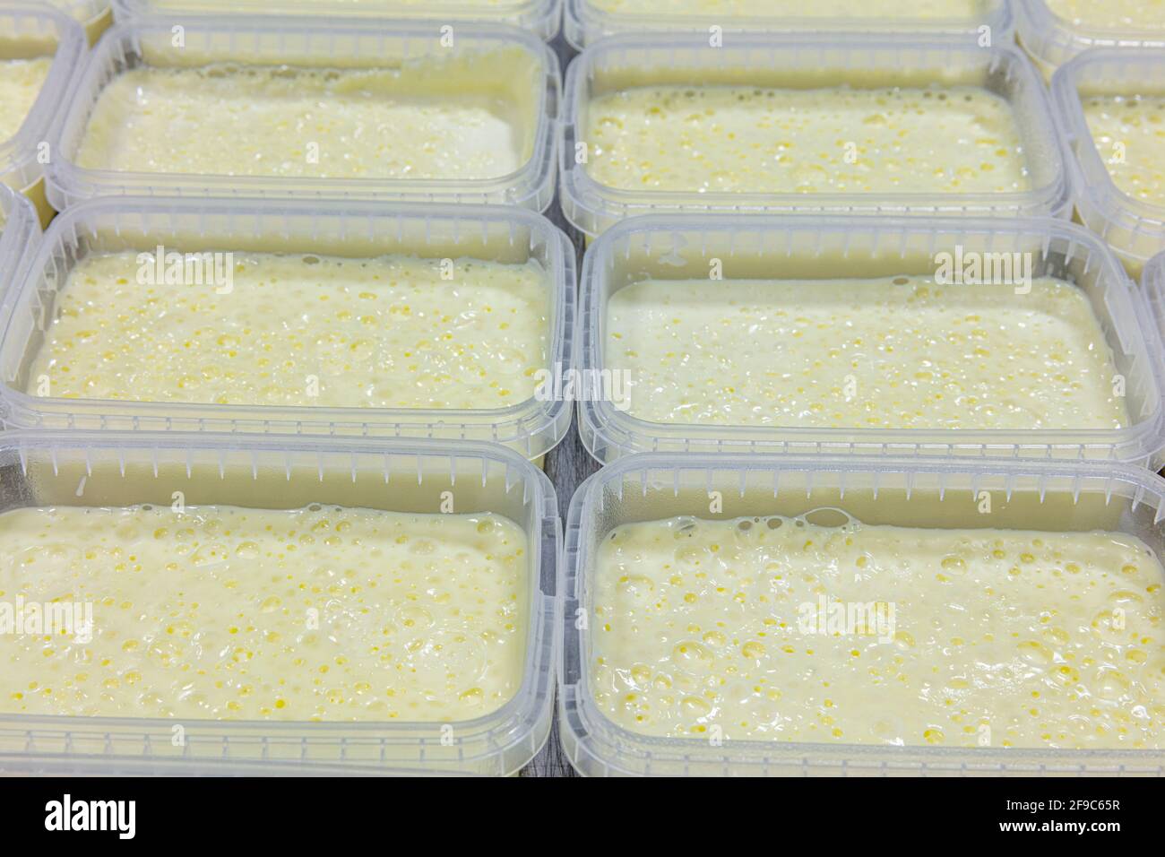 Milky cream wavy surface. Close-up. Milk cream layer texture. Clotted ...