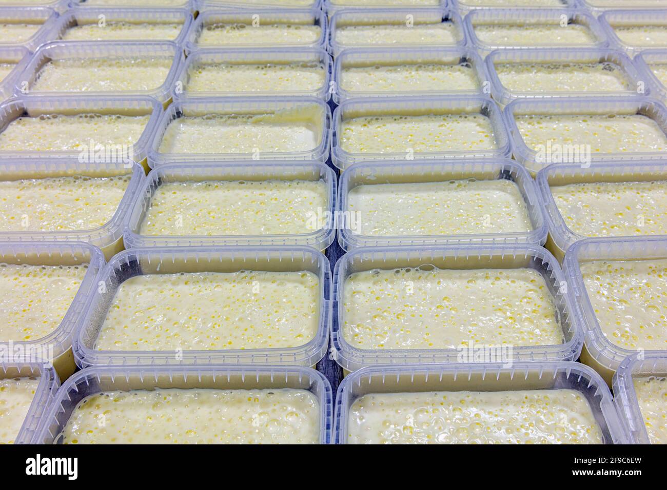 Milky cream wavy surface. Close-up. Milk cream layer texture. Clotted ...