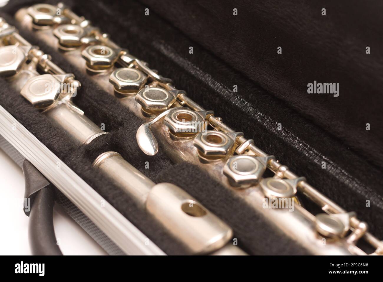 Open case with flute lying in it diagonally Stock Photo - Alamy