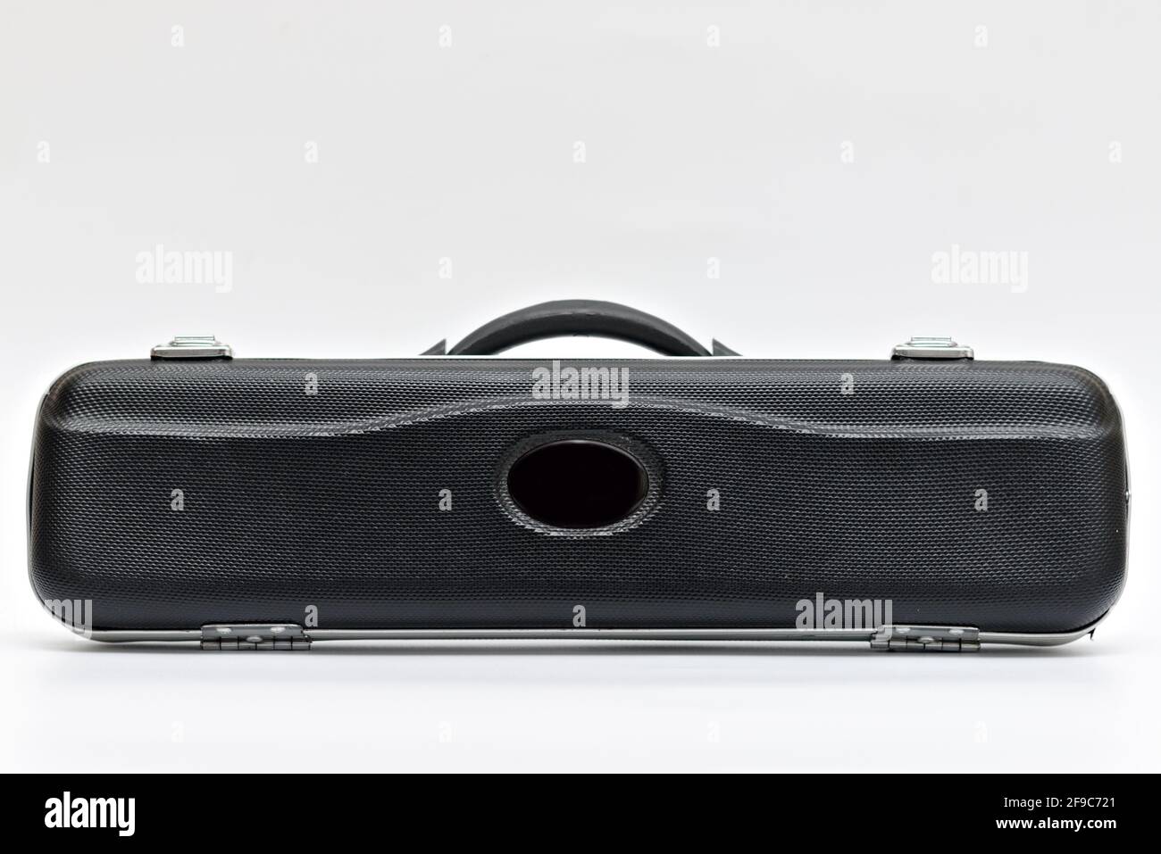 Black long case with locks for a wind musical instrument on a white ...