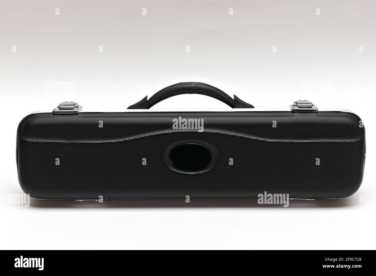 Black long case with locks and a handle for a wind musical instrument ...