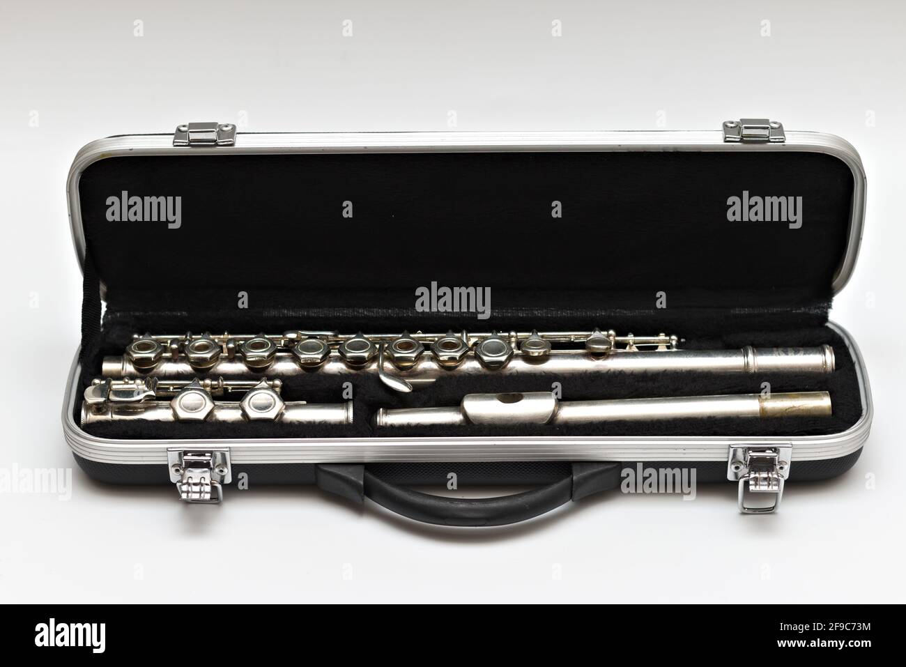 Open case with a disassembled flute lying in it Stock Photo - Alamy