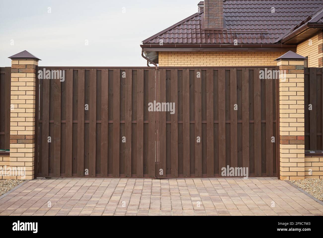 Brown wooden gate and fence Stock Photo - Alamy