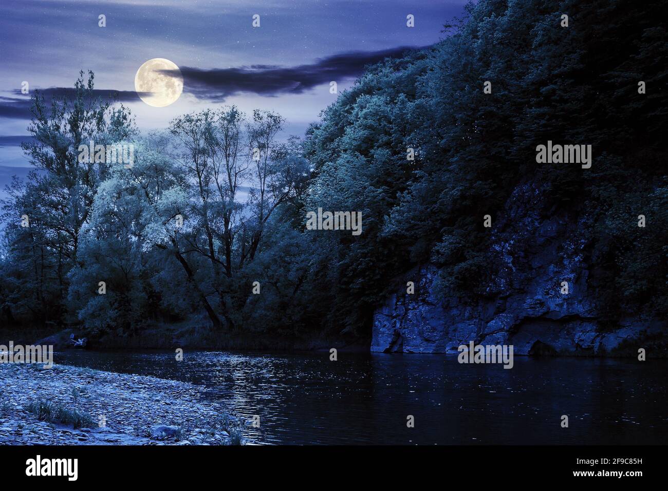 river flow under the rock at night. beautiful nature landscape in ...