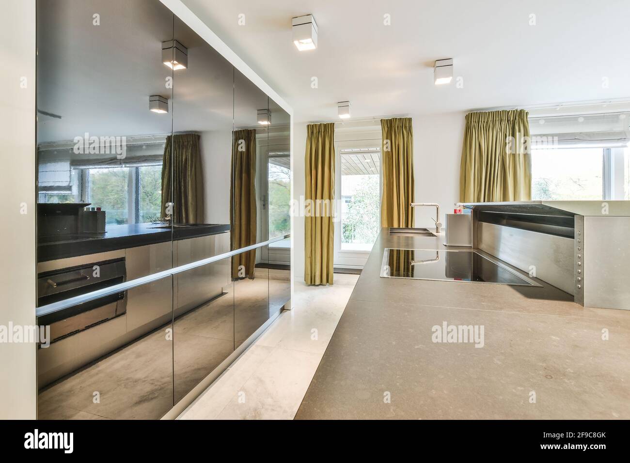 Luxury kitchen counter with extractor fan Stock Photo - Alamy