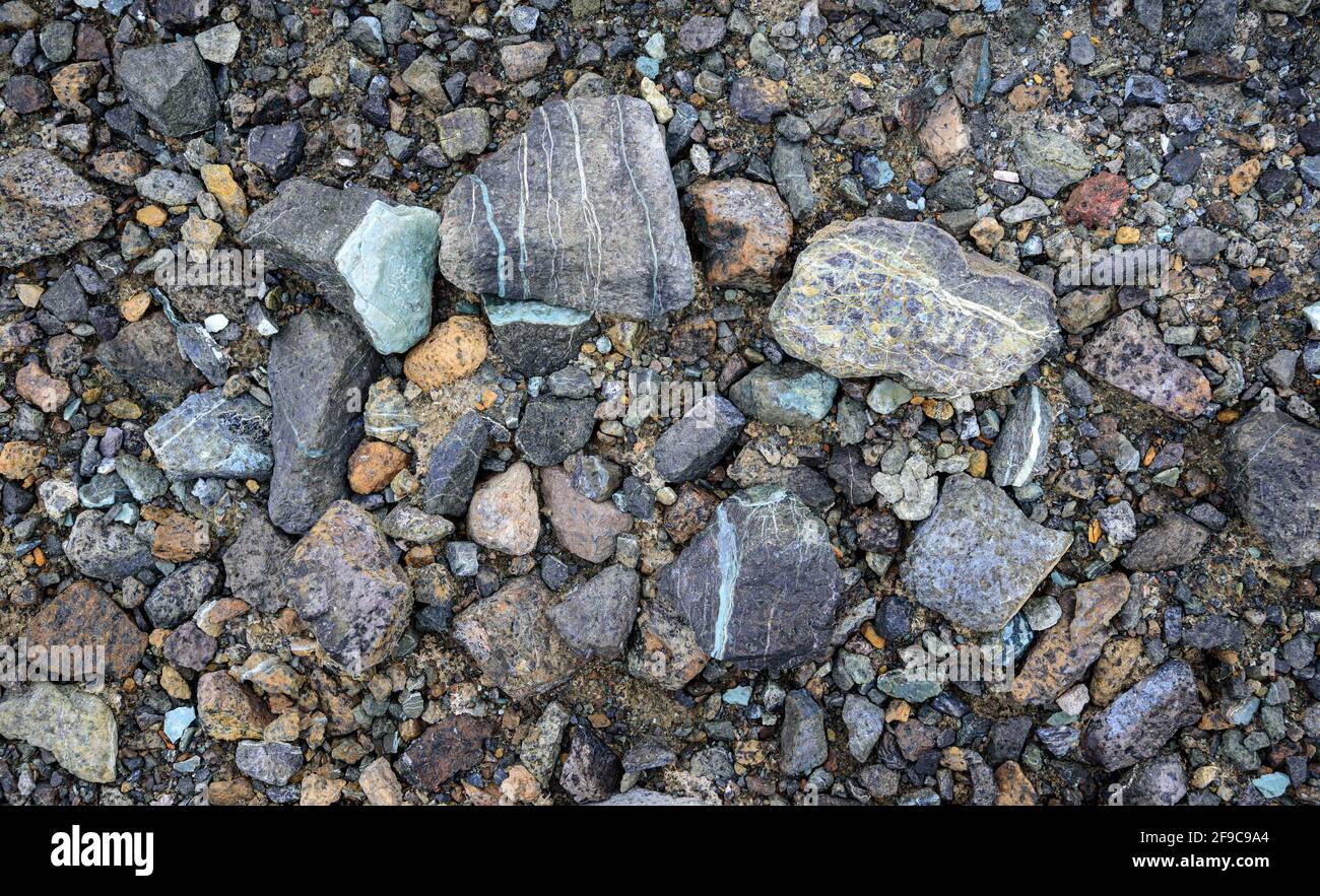 Asbestos mine tailings. Multicolored rocks near abandoned asbestos mine ...