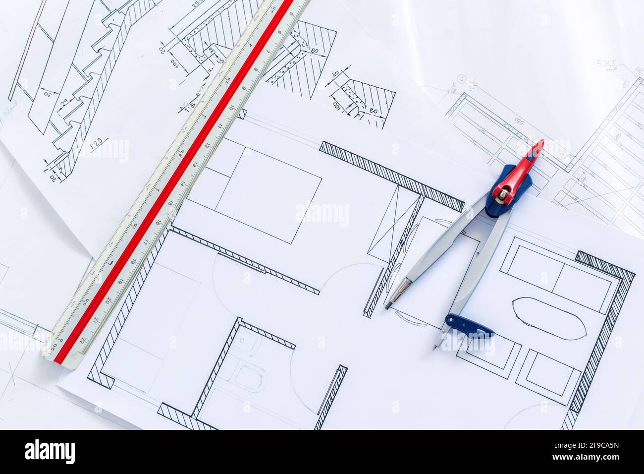 Closeup of engineer drawings, work project paper prints with measuring ...