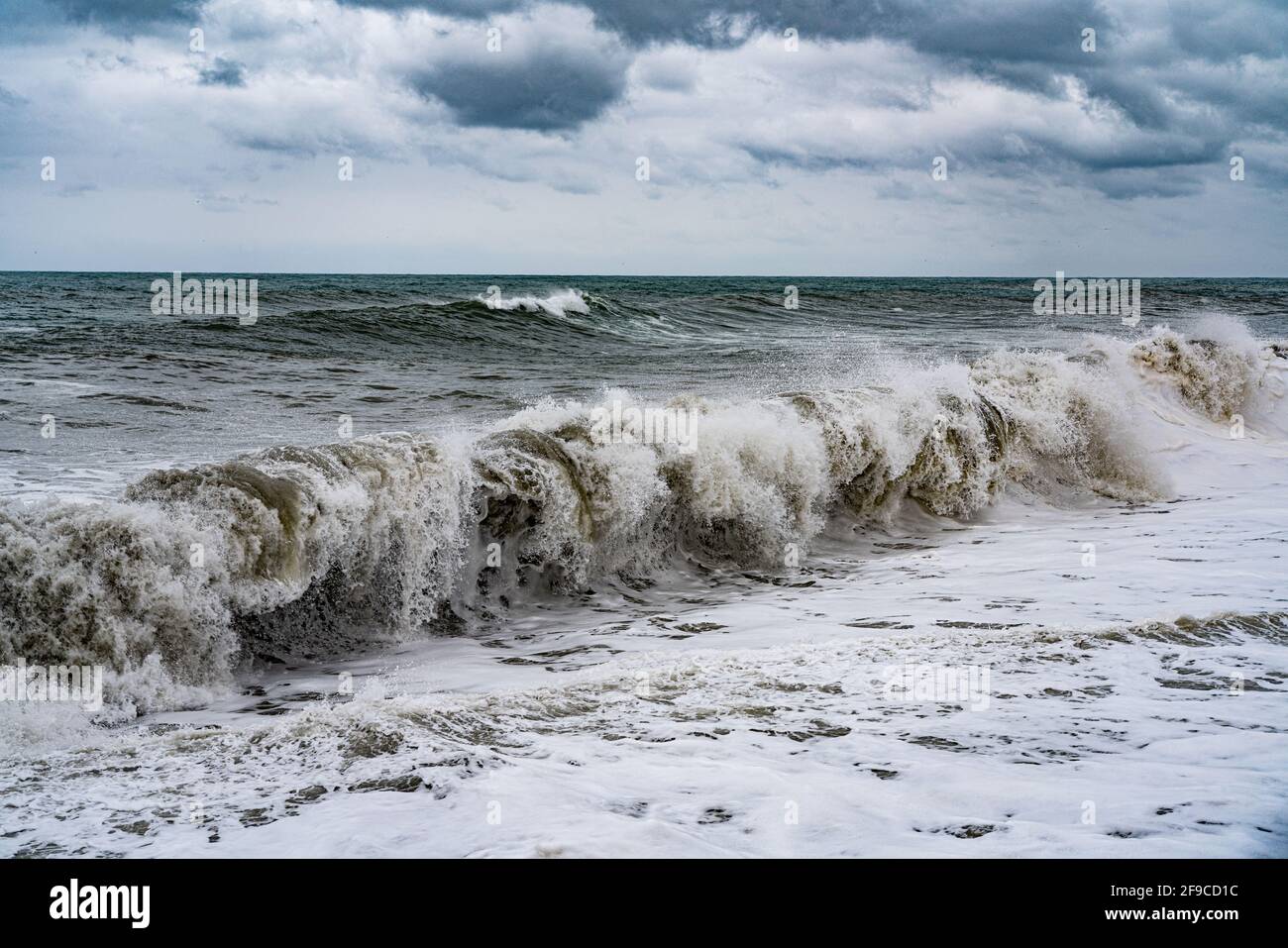 Hurricane storm clouds over ocean waves hi-res stock photography and ...