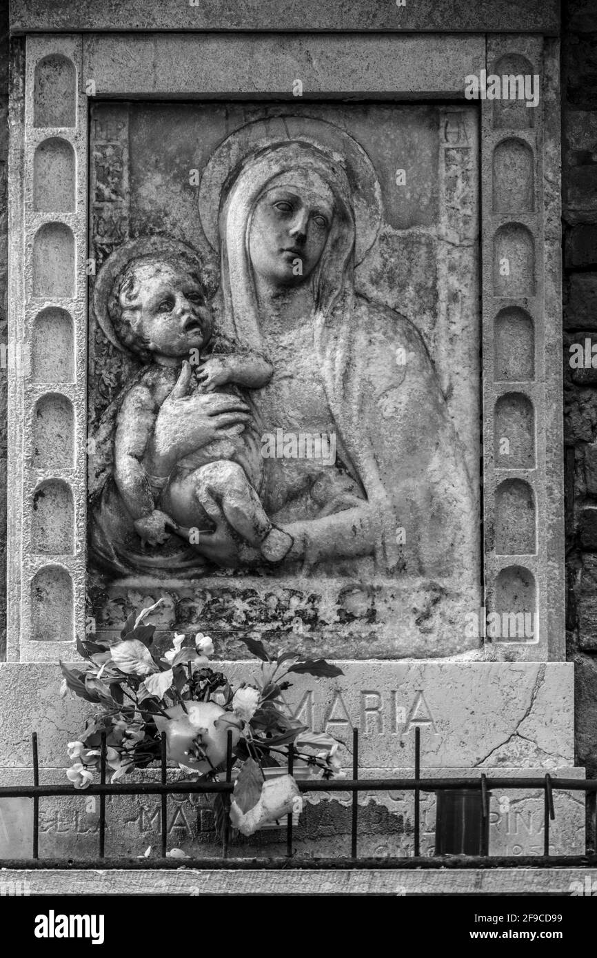 Grayscale shot of a relief with Saint Mary and Jesus Stock Photo - Alamy