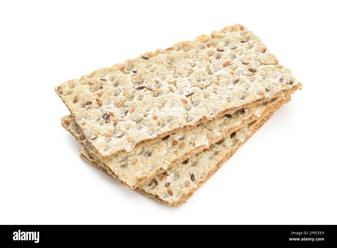 Stack of wholegrain dry crispy bread isolated on a white background in ...