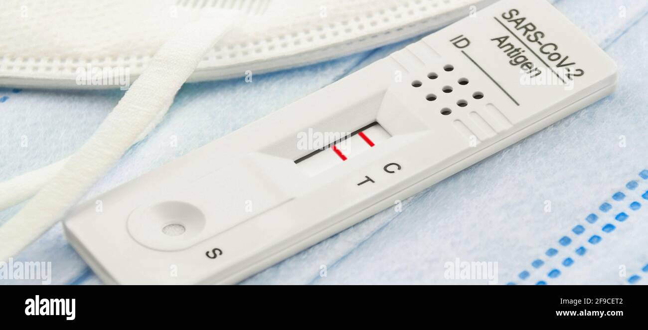 Rapid Antigen Test positive and face mask Stock Photo - Alamy
