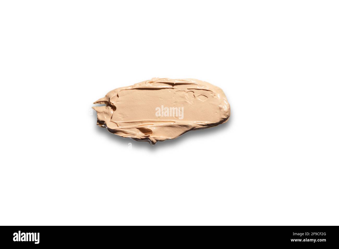 A smear of makeup foundation isolated on a white background. Swatch ...