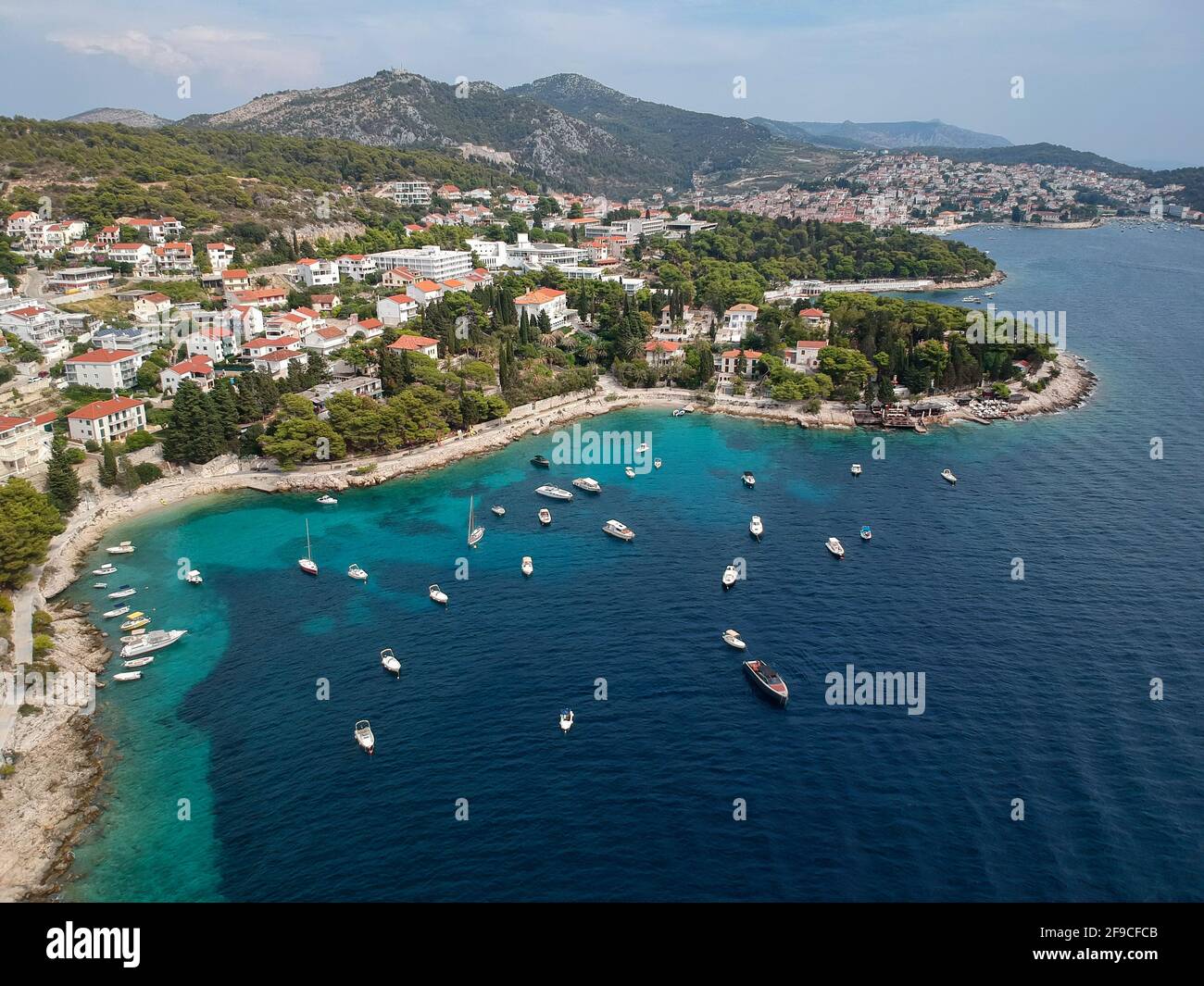 Port of Hvar with the old city and Hvar castle in the distance Stock ...