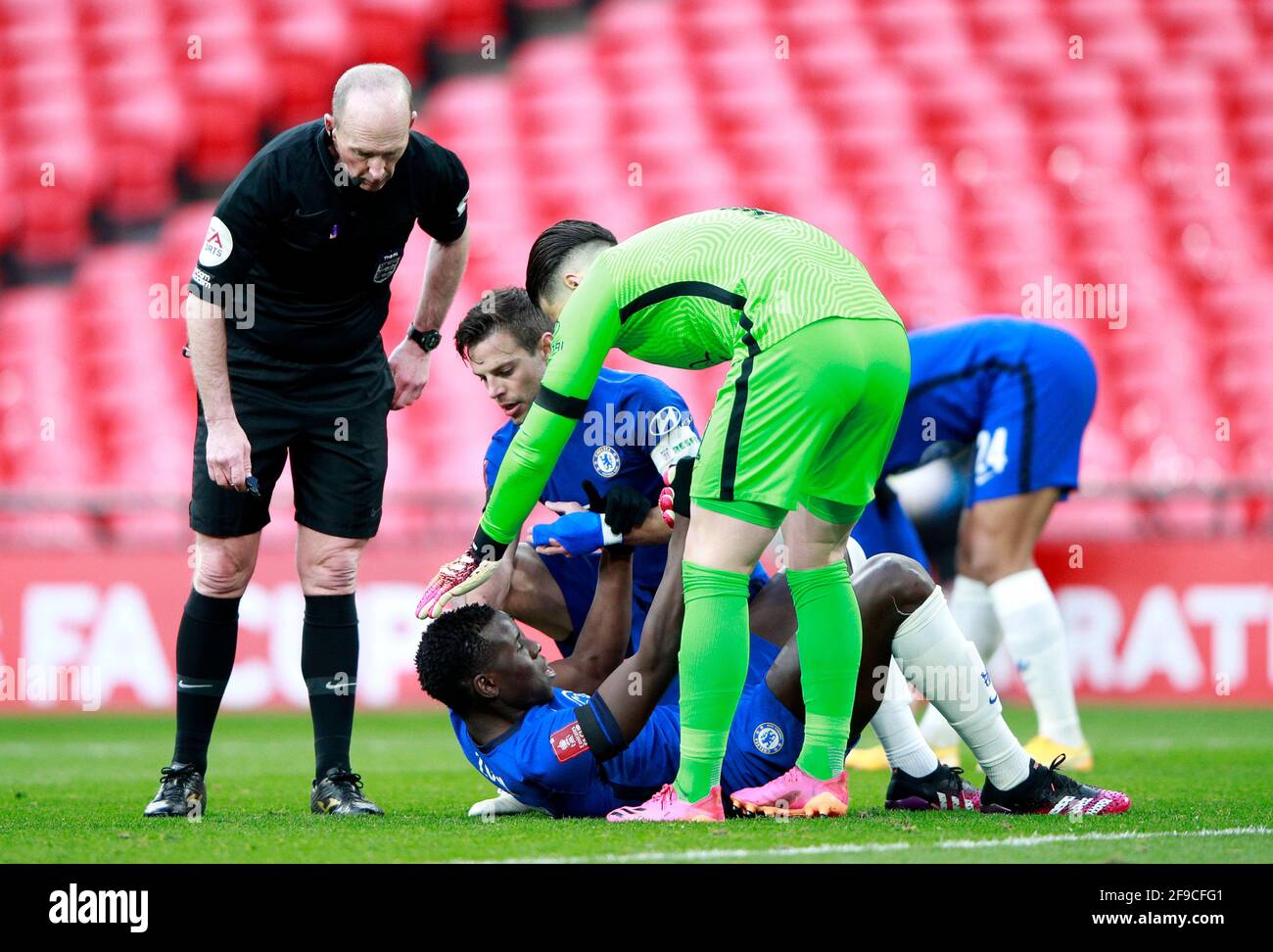 Chelsea's Kurt Zouma reacts to an injury during the FA Cup semi final ...