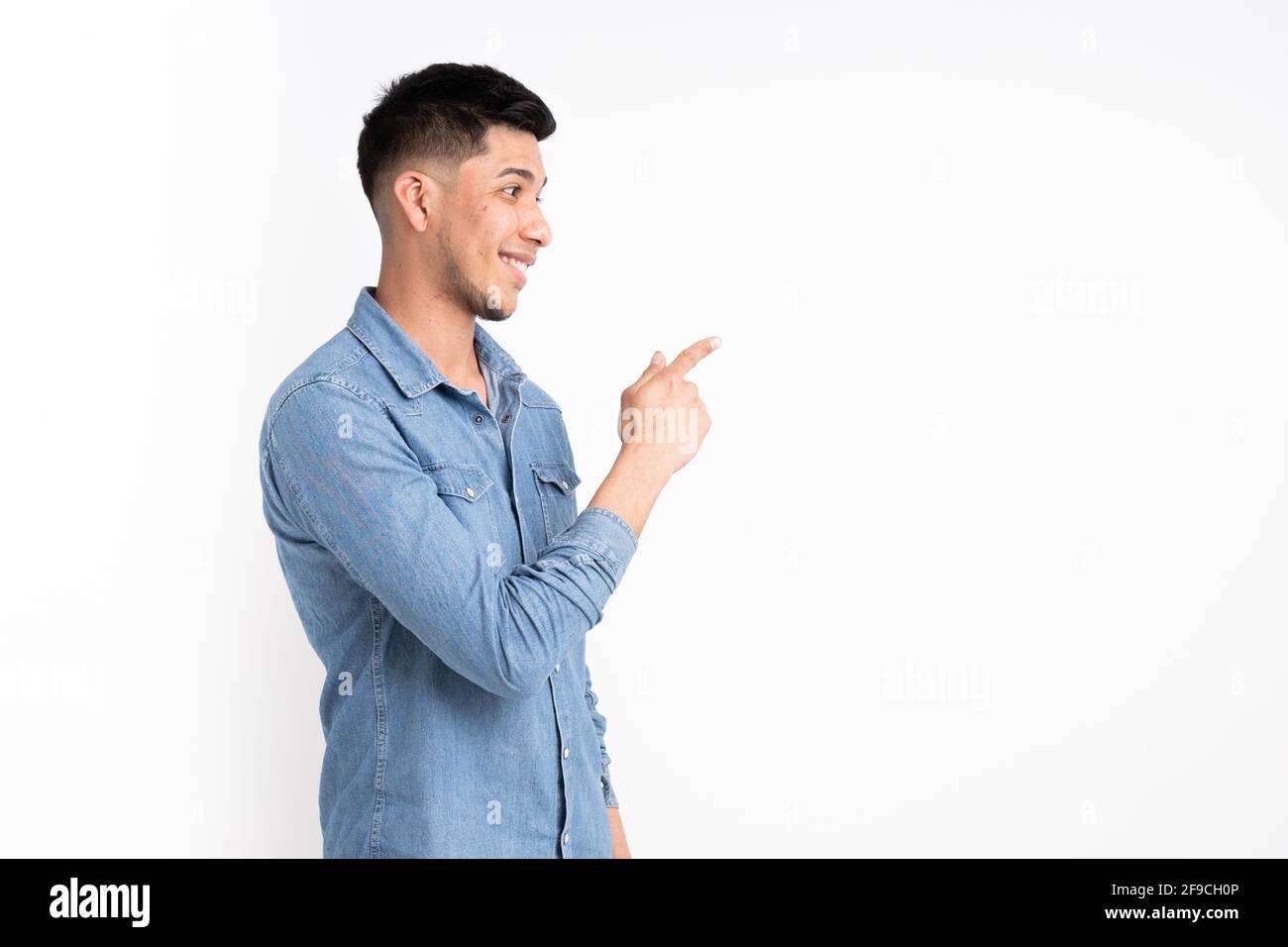 Man smiling pointing side hi-res stock photography and images - Alamy
