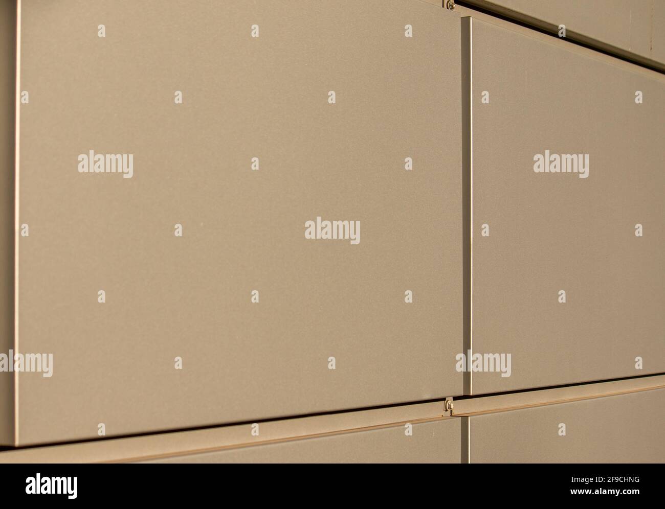Perspective view of a wall of metal blocks panels Stock Photo - Alamy